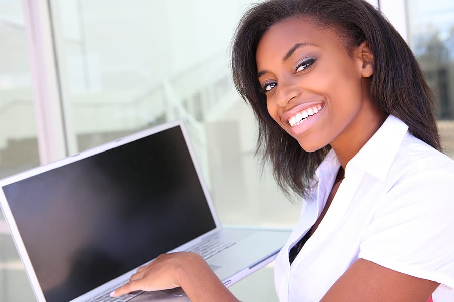 African Business Woman with Computer | Gesatech Solutions